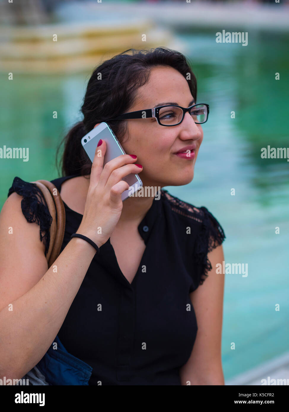 Young Turkish girl is taking a phone call Stock Photo - Alamy