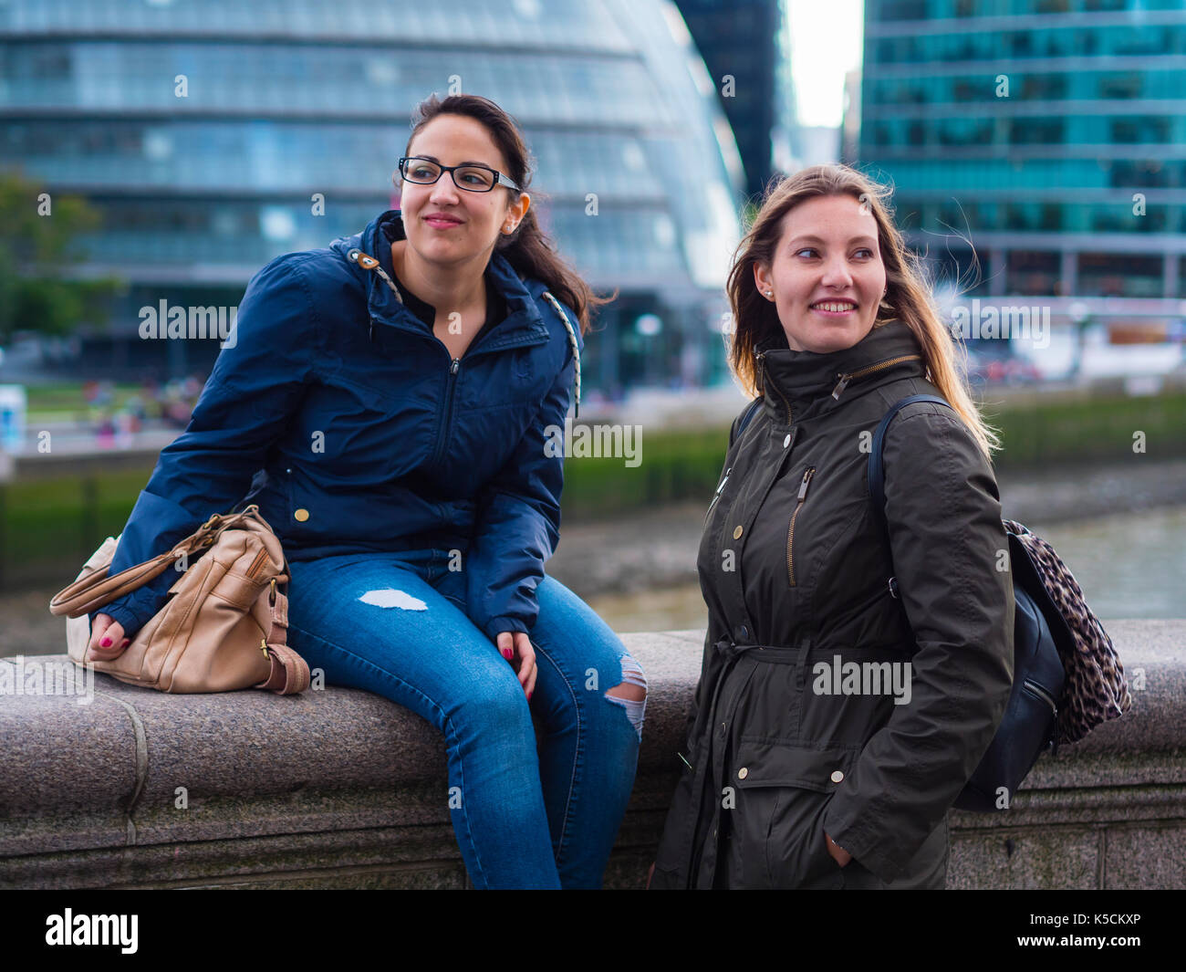 Two girls on the Tower Bridge in London Stock Photo - Alamy