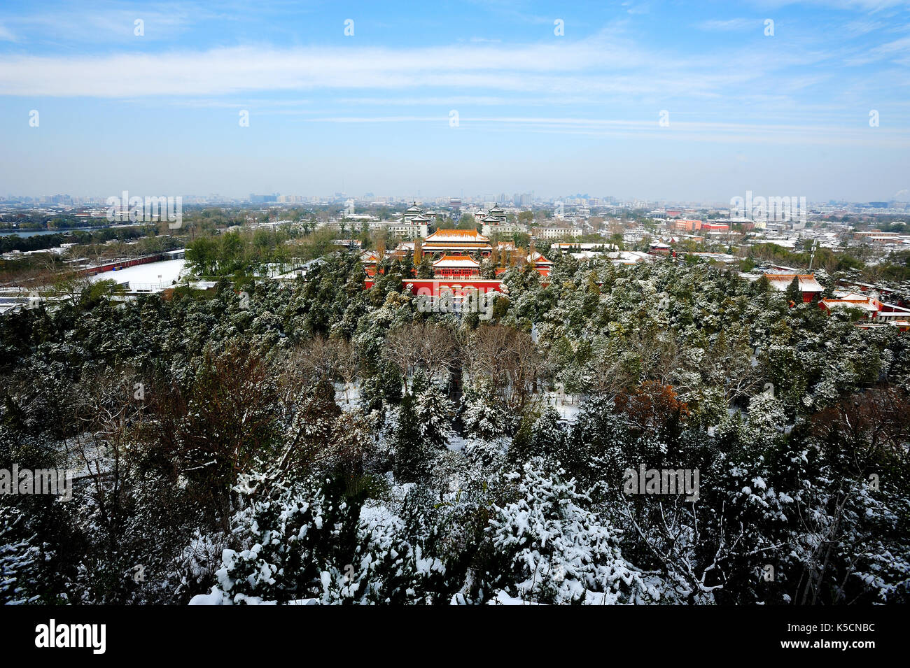 Standing on top of the Jingshan Park overlooking the Beijing after snow ...
