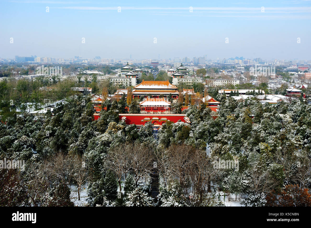 Standing on top of the Jingshan Park overlooking the Beijing after snow ...