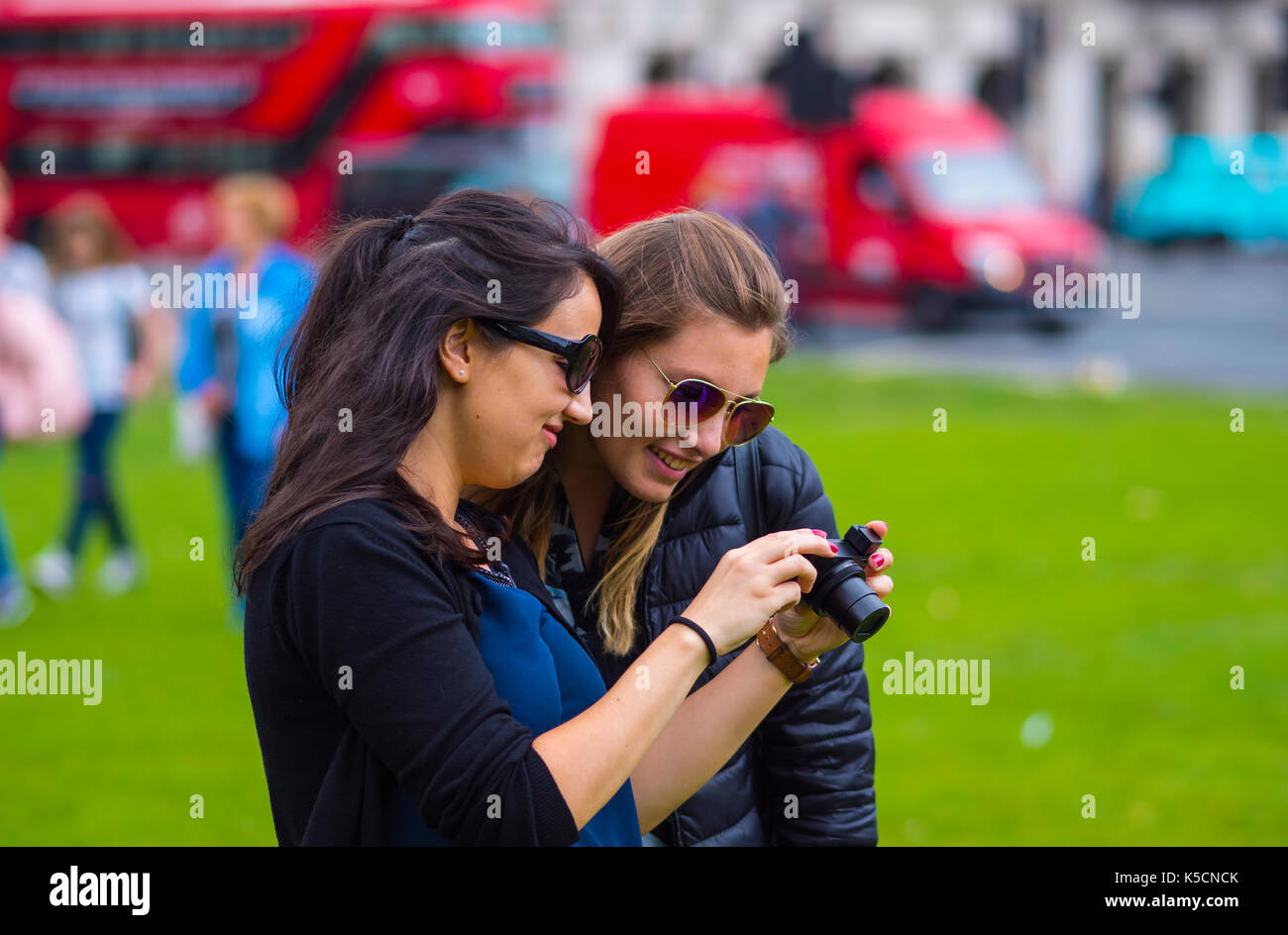 Checking photos on the camera Stock Photo - Alamy