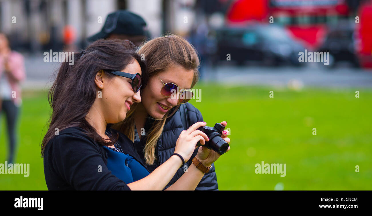 Checking photos on the camera Stock Photo - Alamy