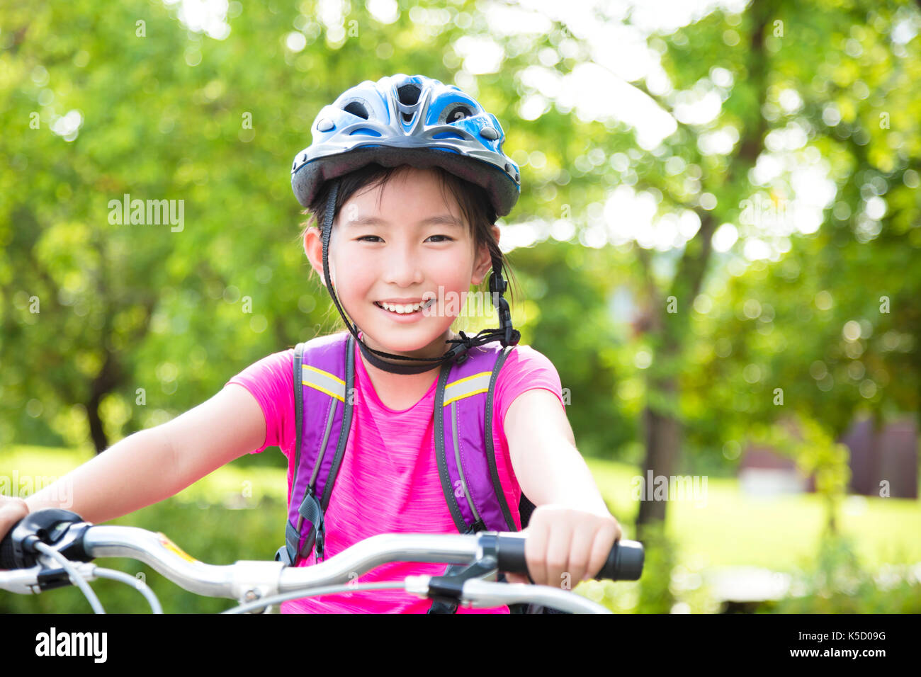 Chinese girl riding bicycle in hi-res stock photography and images - Alamy