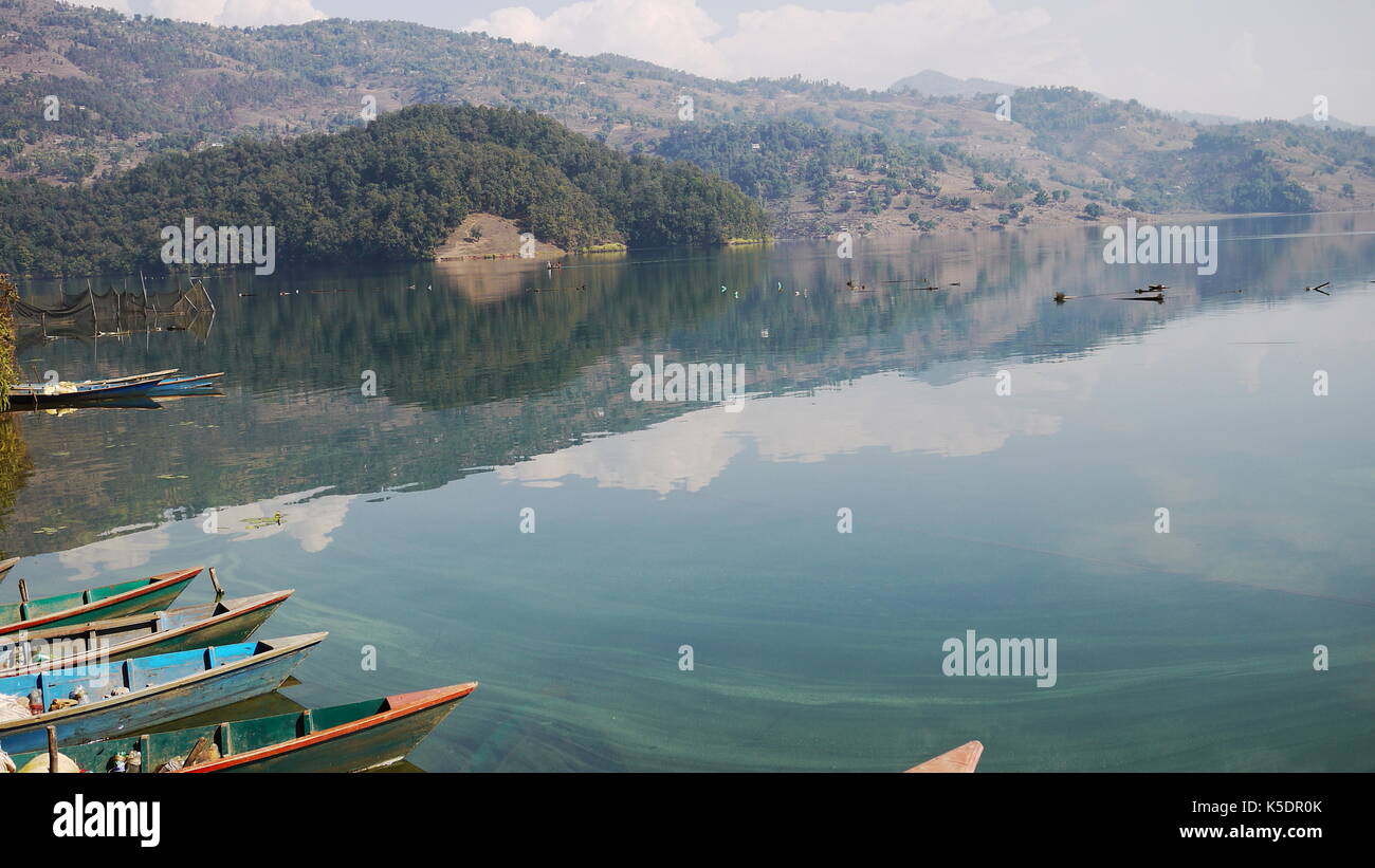 lakeside in Pokhara with the fishing net with mountain range Stock ...