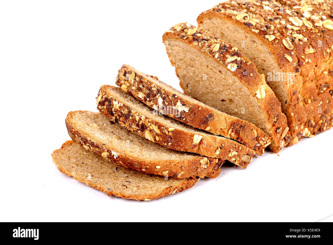 multi grain bread with slices on white surface Stock Photo - Alamy