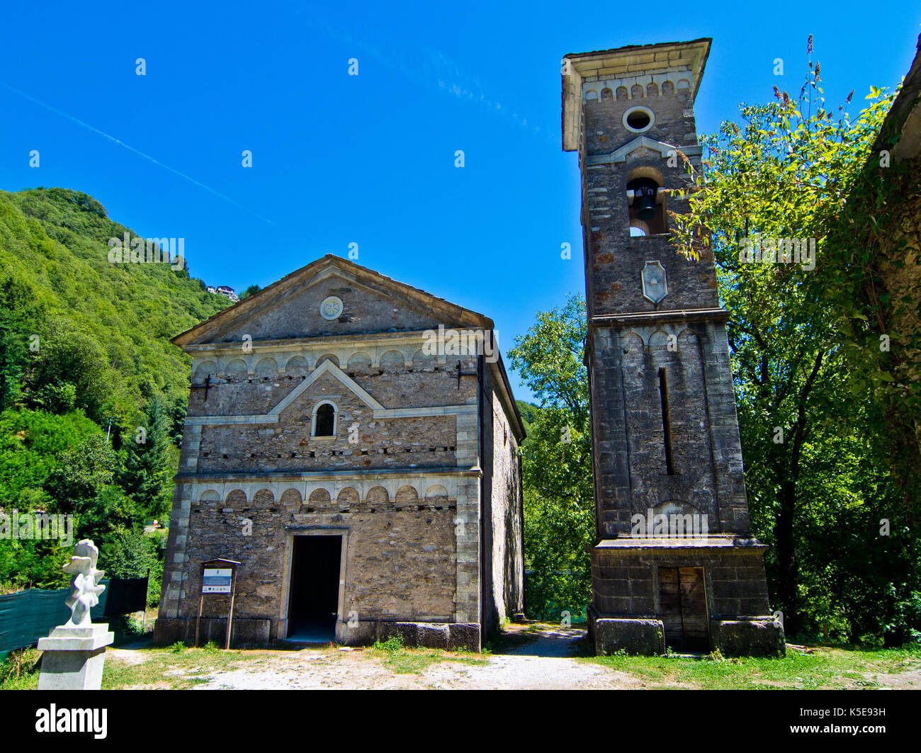 mountain church built in stone with bell tower with marble arches and ...