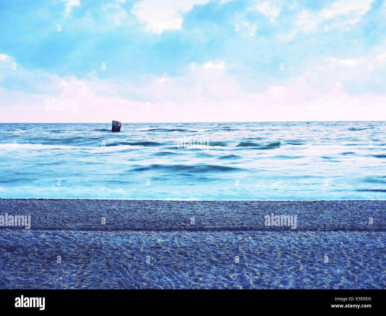 Beautiful marine view on sea coast line with smooth water over sandy ...