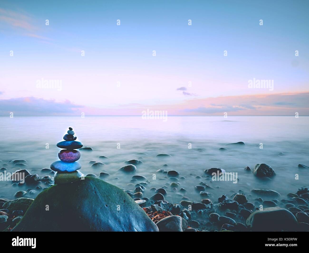 Rounded colorful stones stand in the form of pyramid big rounded stone ...