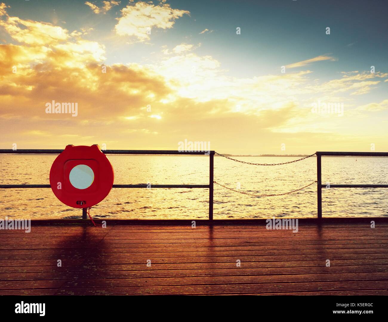 Empty wooden pier at beautiful colorful morning. Tourist mole in wharf ...