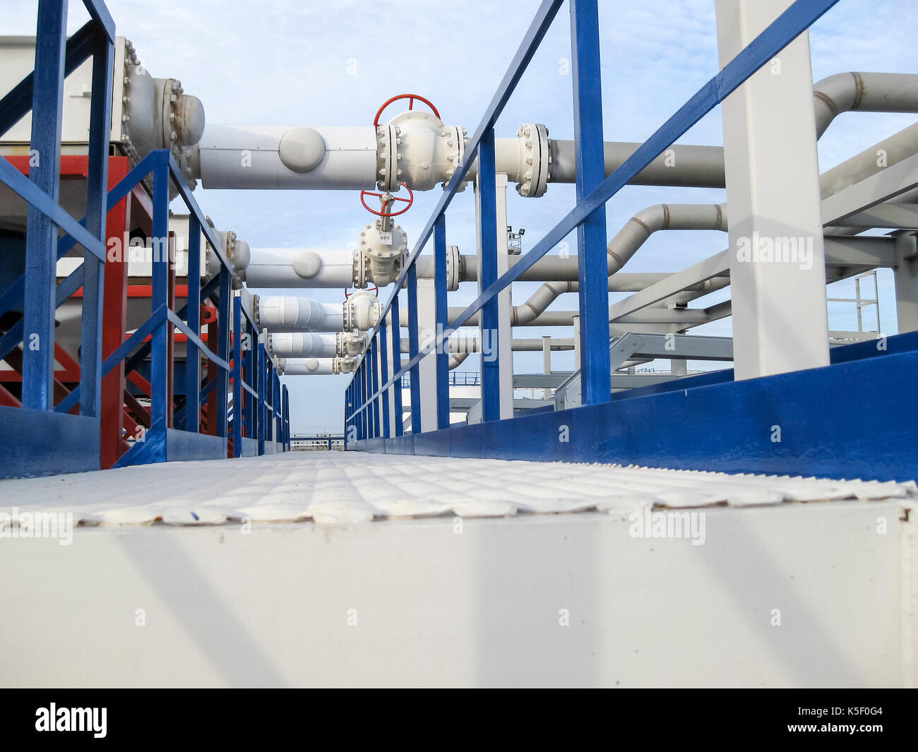 Steel service platform and stairs. Equipment refinery Stock Photo - Alamy