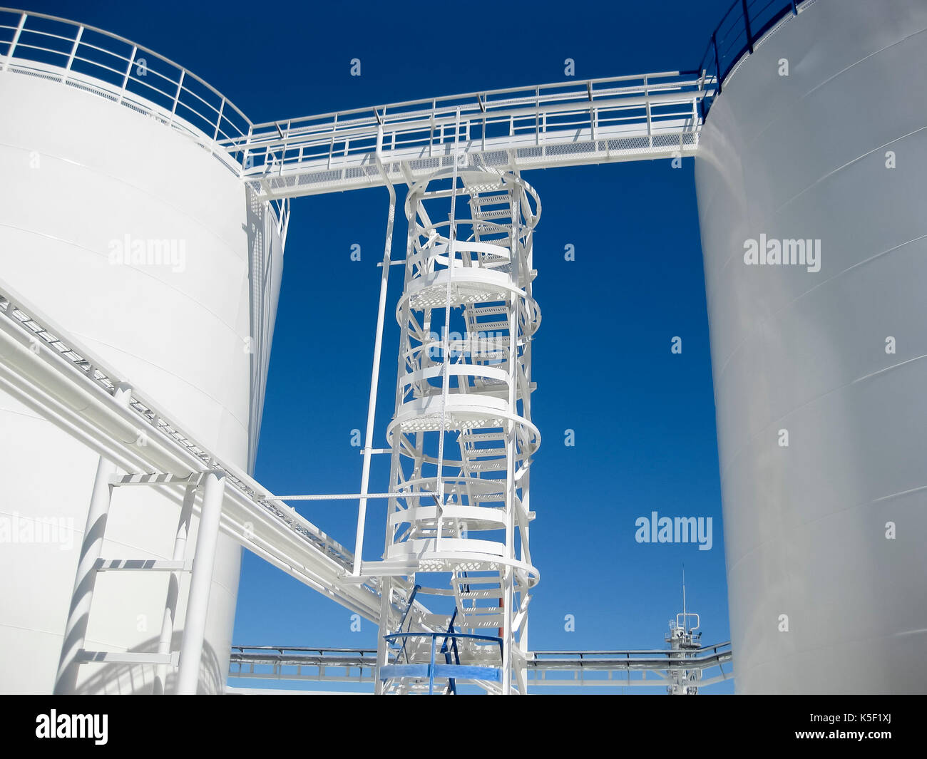 The tank with water and a ladder. Oil refinery. Equipment for primary ...