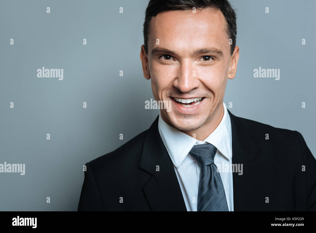 Happy handsome man looking at you Stock Photo - Alamy