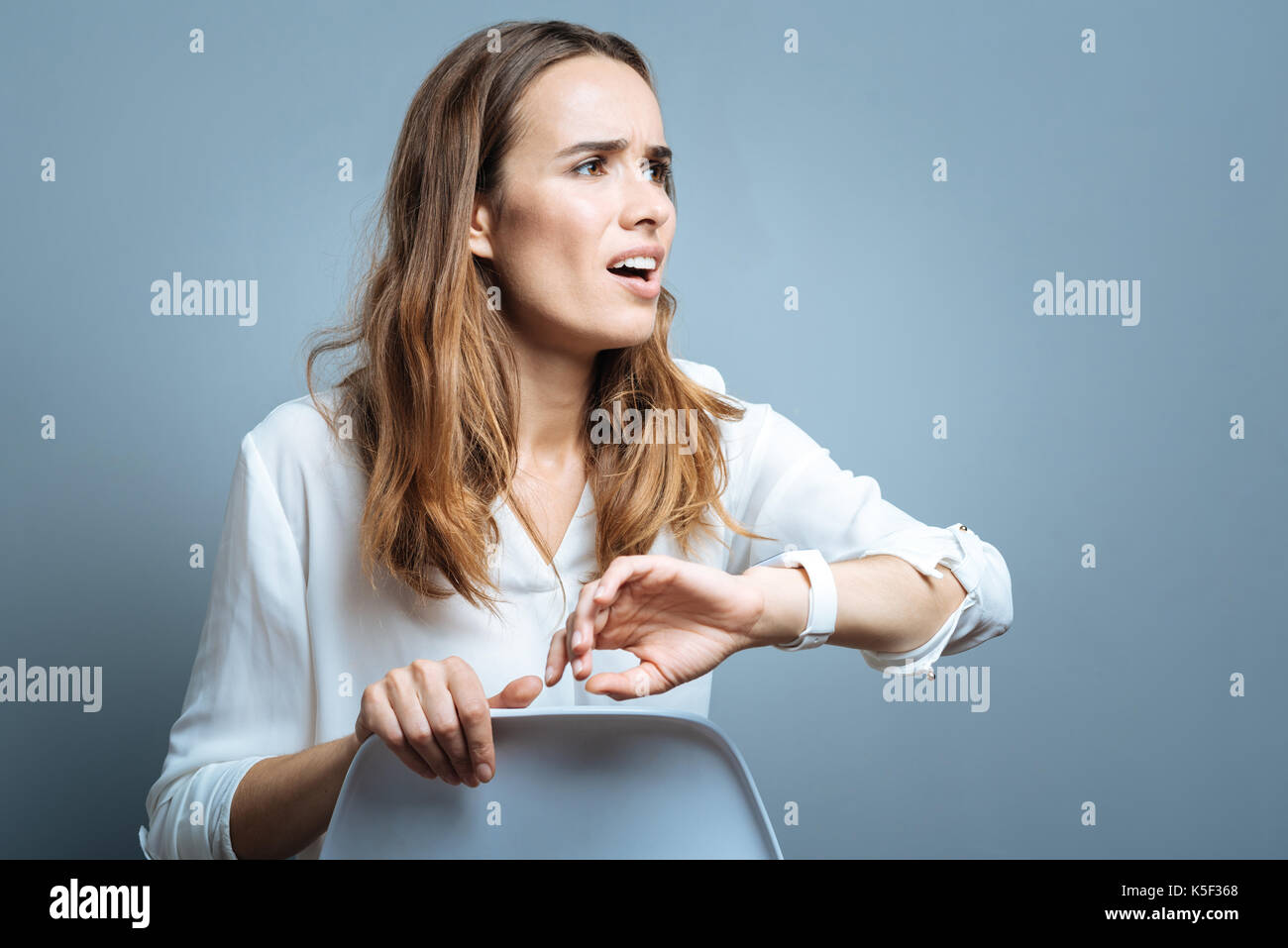 Cheerless nervous woman being late Stock Photo - Alamy