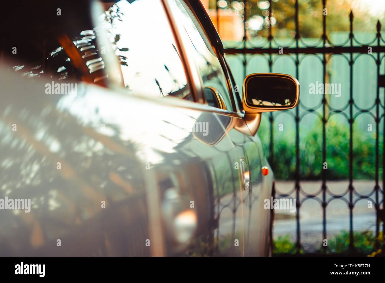 Modern blue car tail light in wet rain drop. Red modern car back light ...