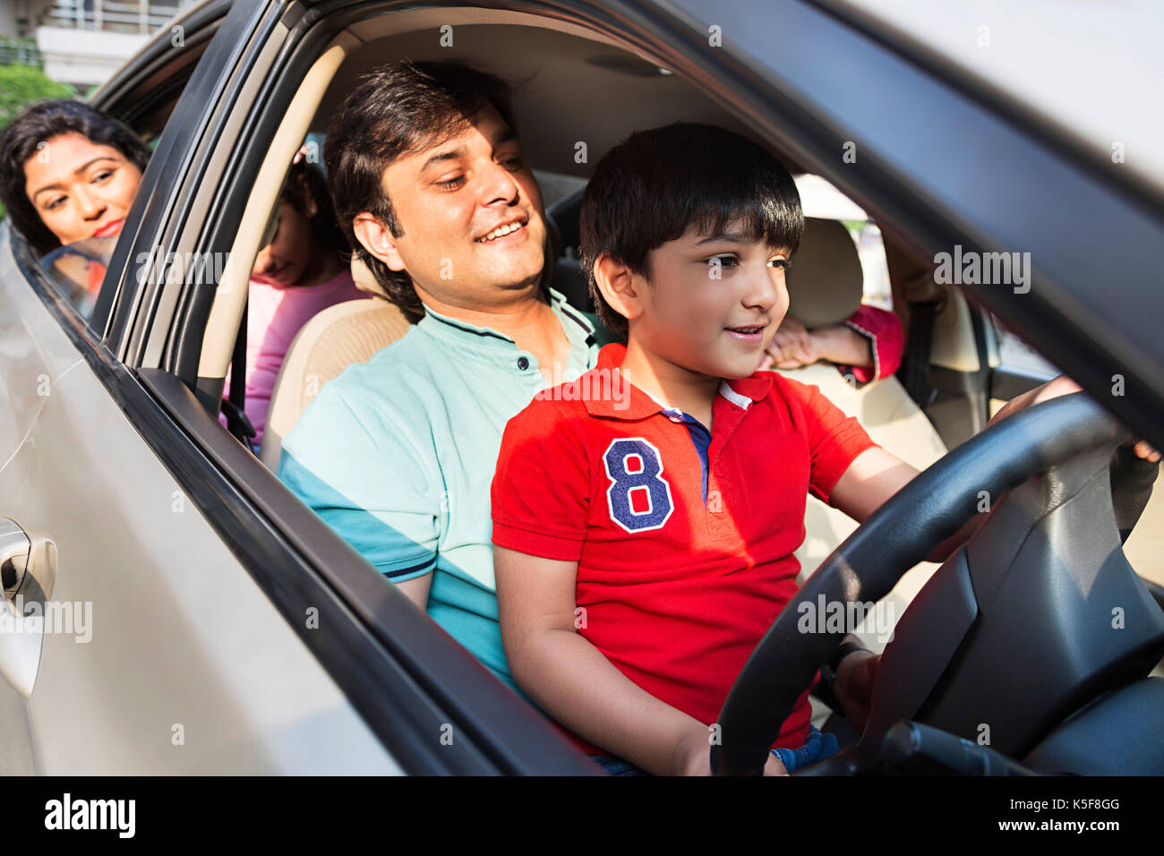 Parents and Kids Father And Son sitting Car Driving Happy Journey Stock ...