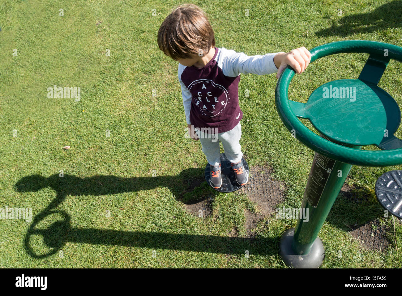 Boy looking at his own shadow Stock Photo - Alamy