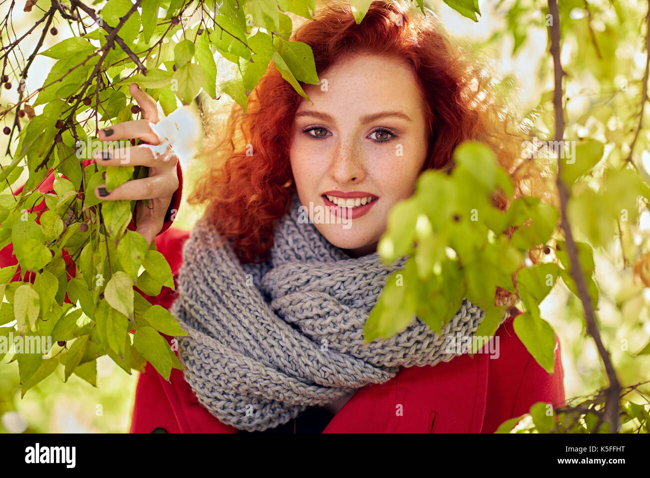Woman among autumn leaves hi-res stock photography and images - Alamy