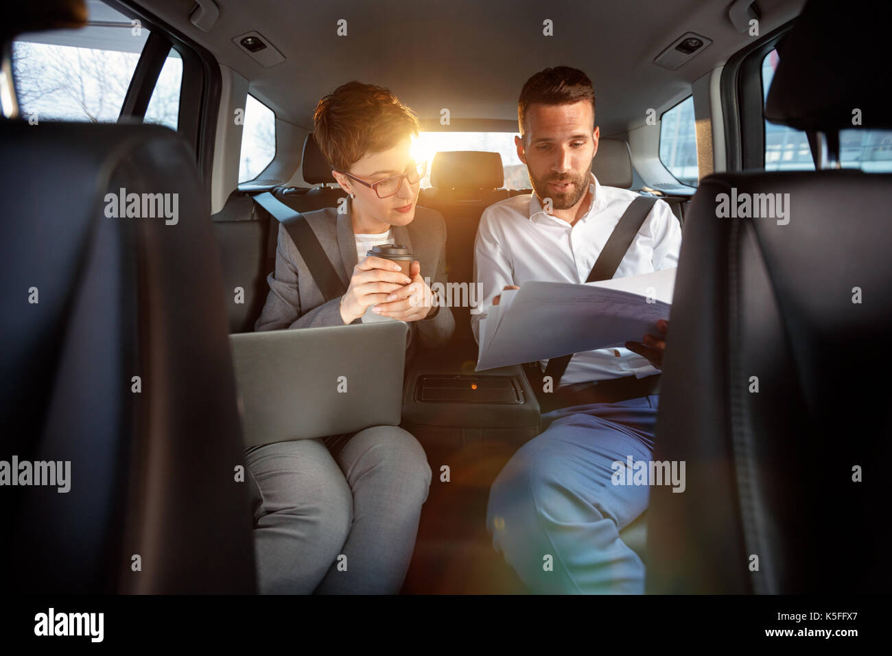 Business couple working in car hi-res stock photography and images - Alamy