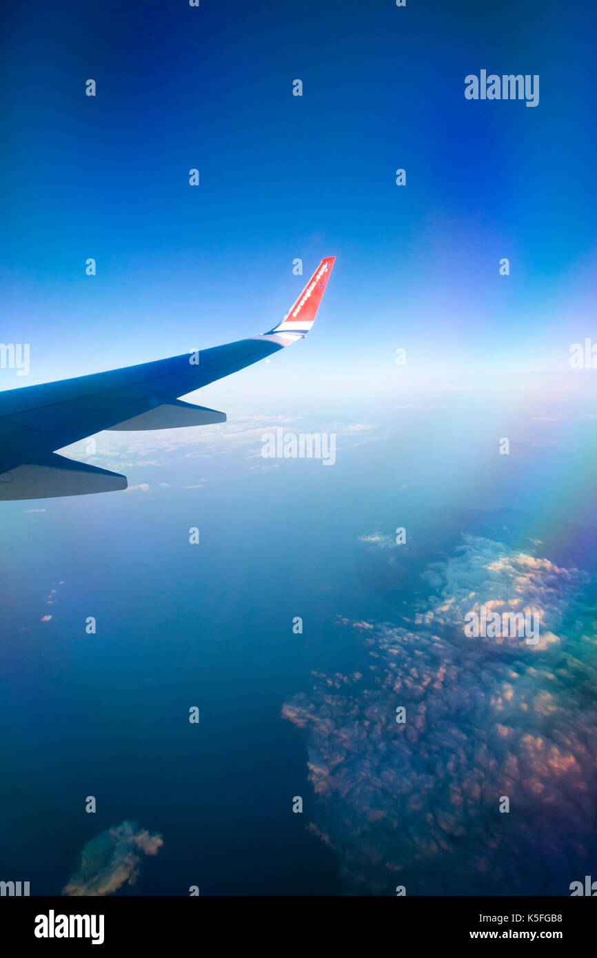 View from Norwegian airplane window with blue sky and white clouds. 08. ...