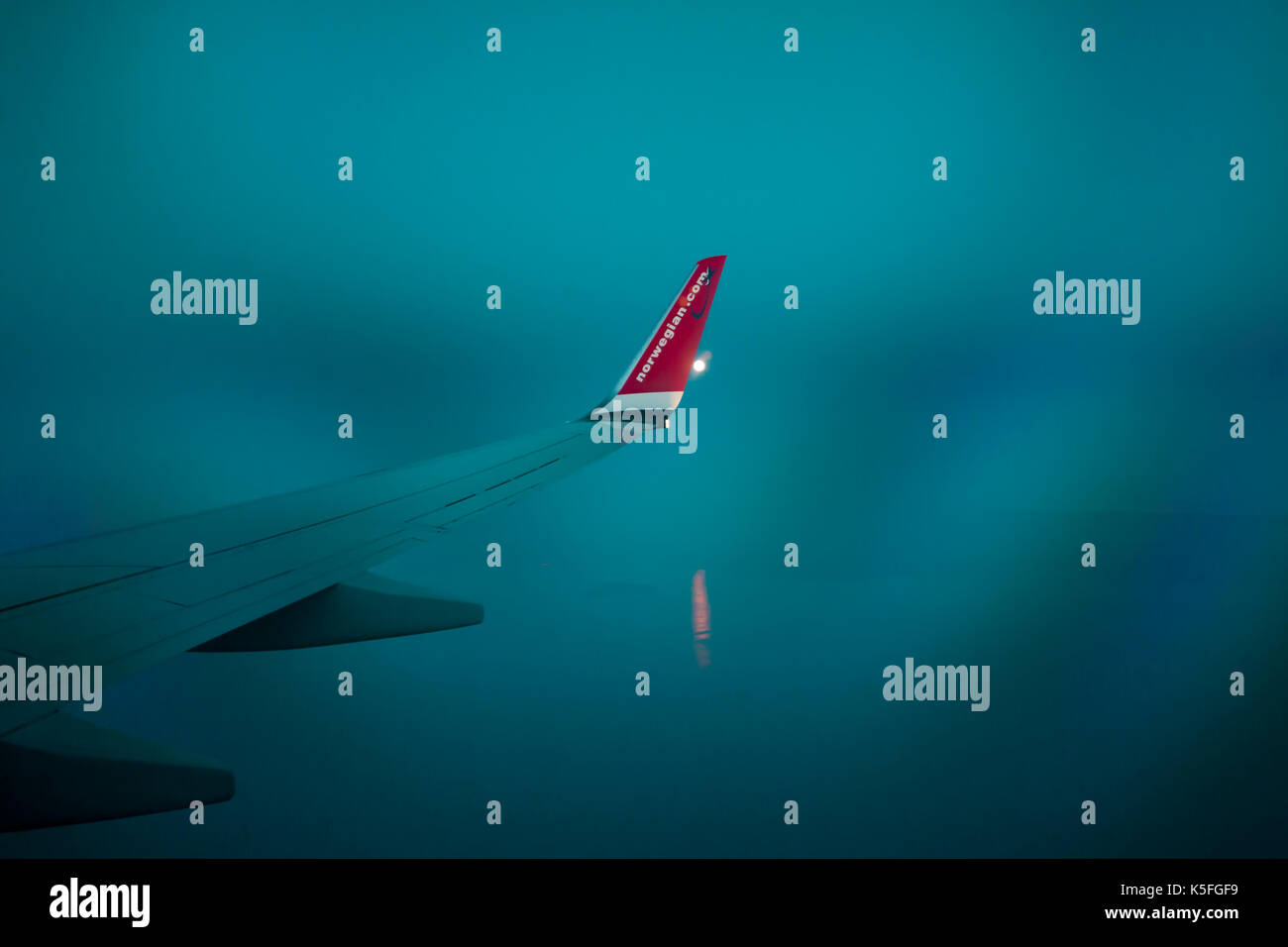 View from Norwegian airplane window with blue sky and white clouds. 08. ...