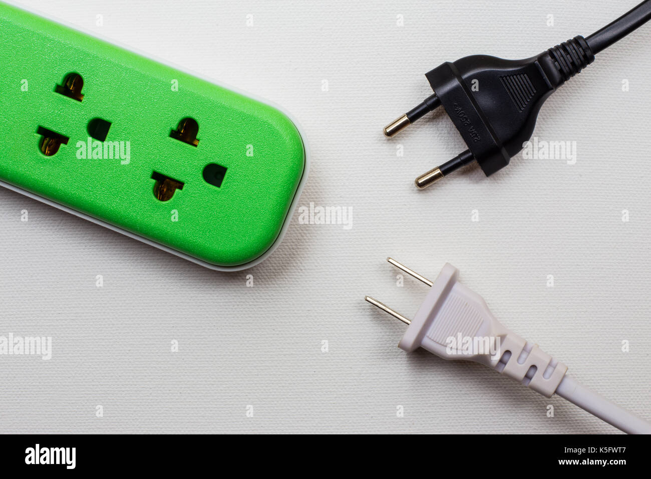 power outlet and power plugs on white background Stock Photo - Alamy