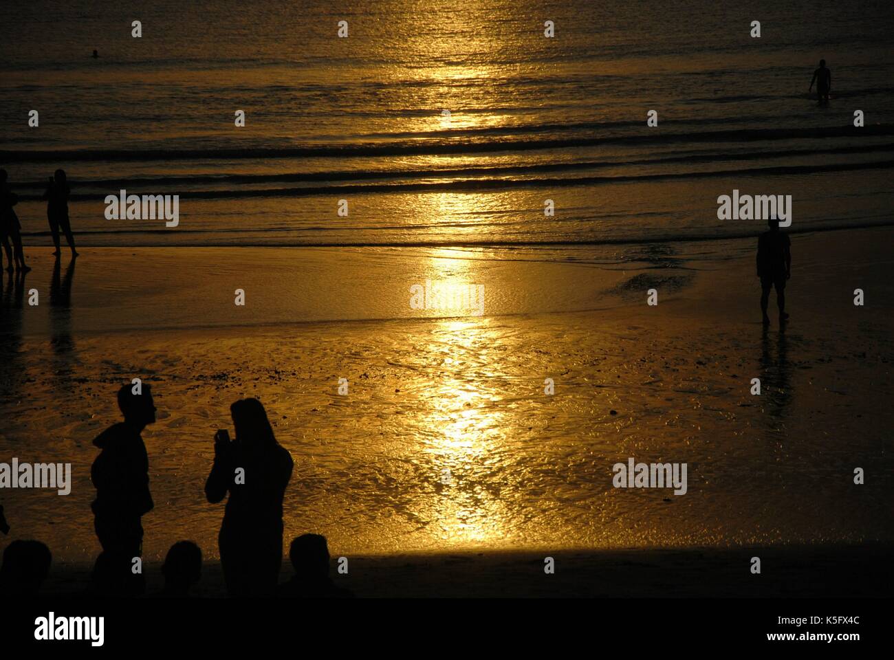 sunset view of a beach in bali, indonesia Stock Photo - Alamy