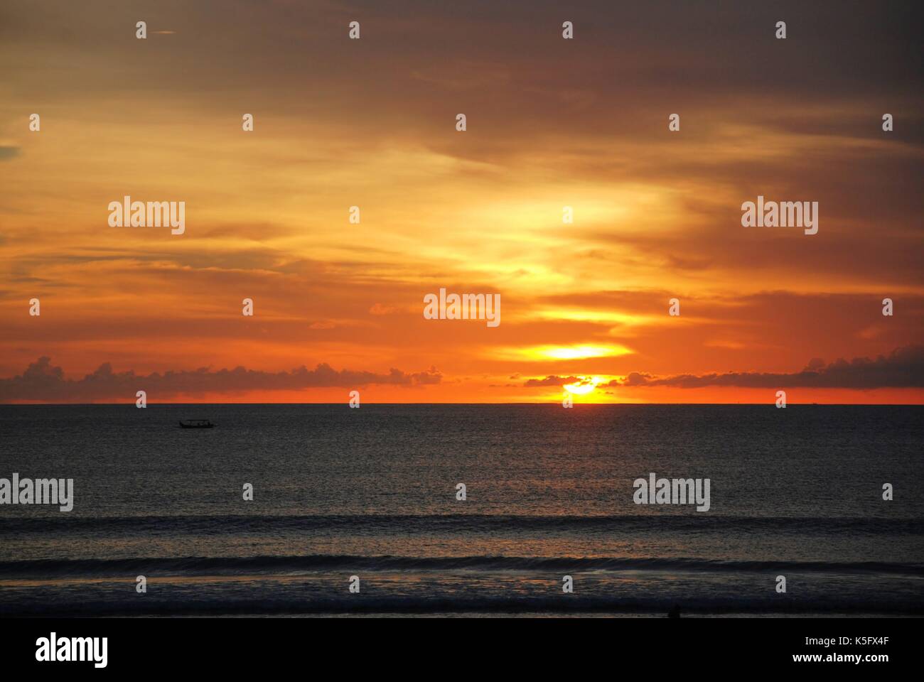 sunset view of a beach in bali, indonesia Stock Photo - Alamy