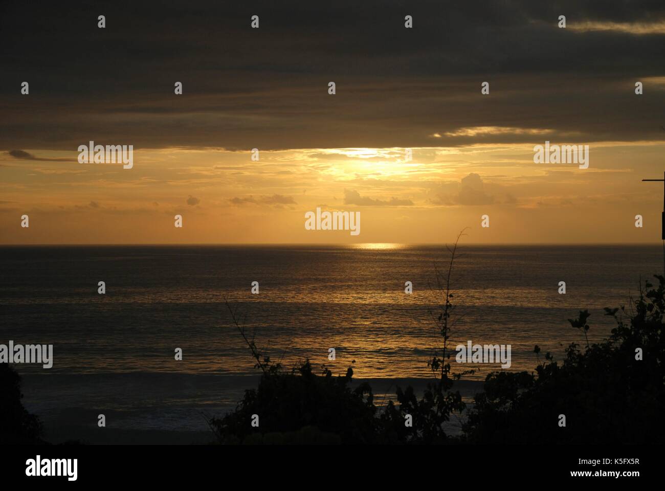 sunset view of a beach in bali, indonesia Stock Photo - Alamy
