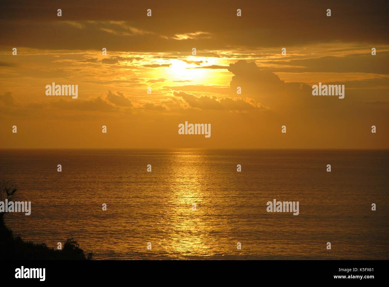 sunset view of a beach in bali, indonesia Stock Photo - Alamy