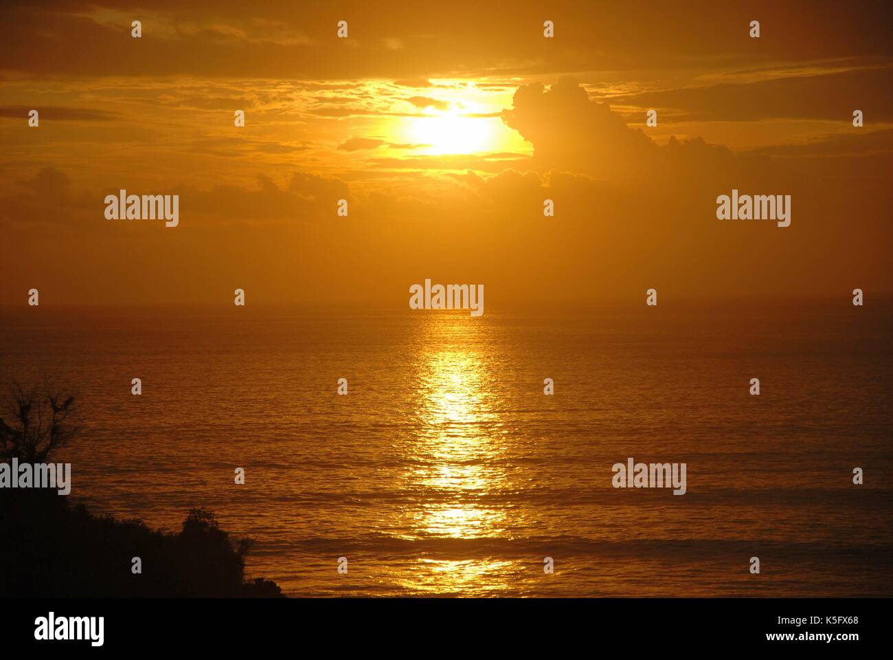 sunset view of a beach in bali, indonesia Stock Photo - Alamy