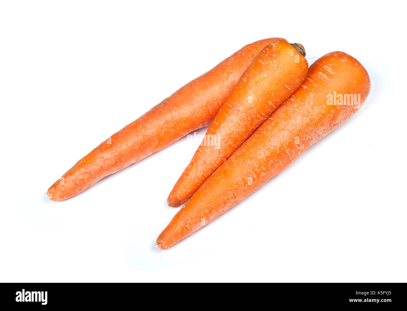 Three carrots isolated on white background Stock Photo - Alamy