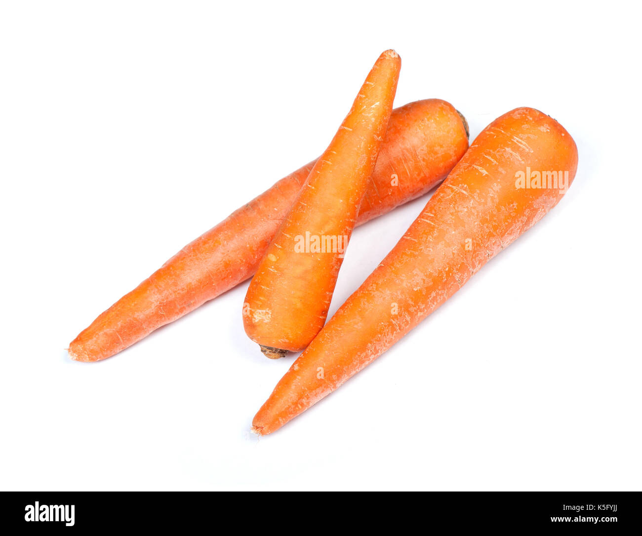 Three carrots isolated on white background Stock Photo - Alamy