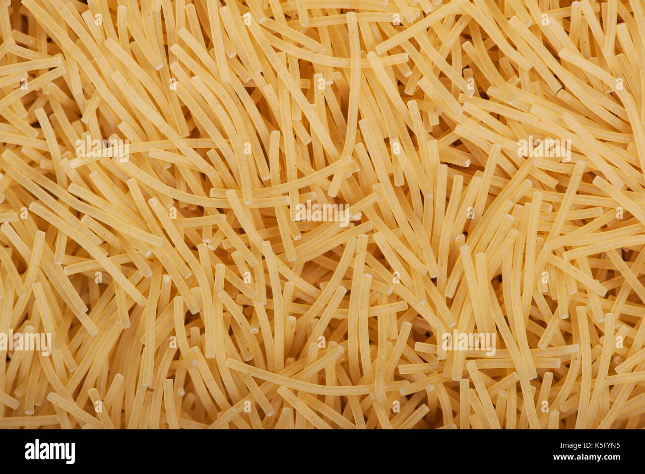Raw vermicelli pasta texture background Stock Photo - Alamy