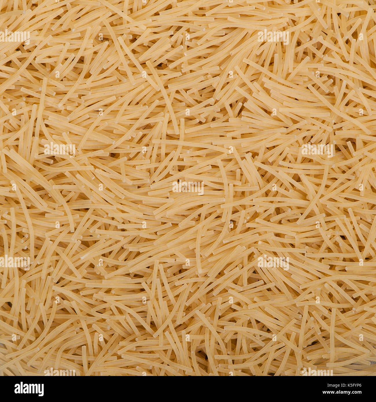 Raw vermicelli pasta texture background Stock Photo - Alamy