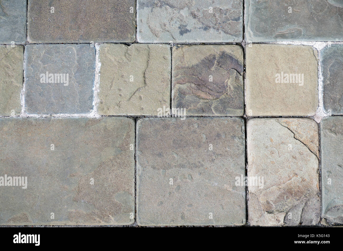 Stone floor in warm colors. Background of stone bricks of different ...