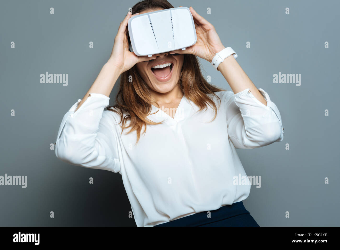 Delighted happy woman showing her emotions Stock Photo - Alamy