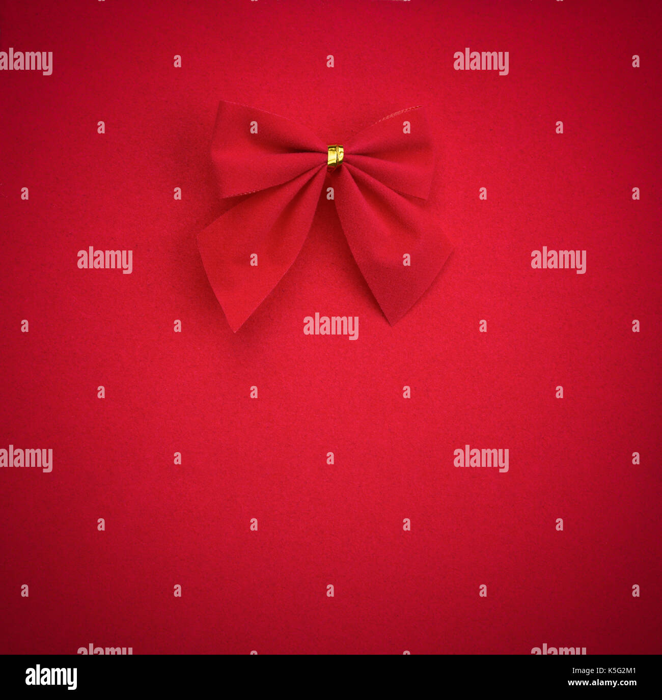 red bow on red background with vignette. mock up for text ...