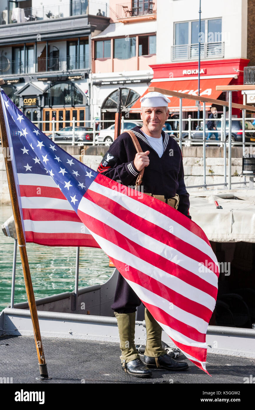 England, Ramsgate. US navel sailor standing guard on deck of P22 Rhine ...