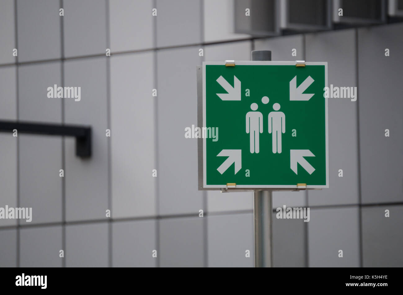 Sign indicating gathering spot in case of emergency Stock Photo - Alamy