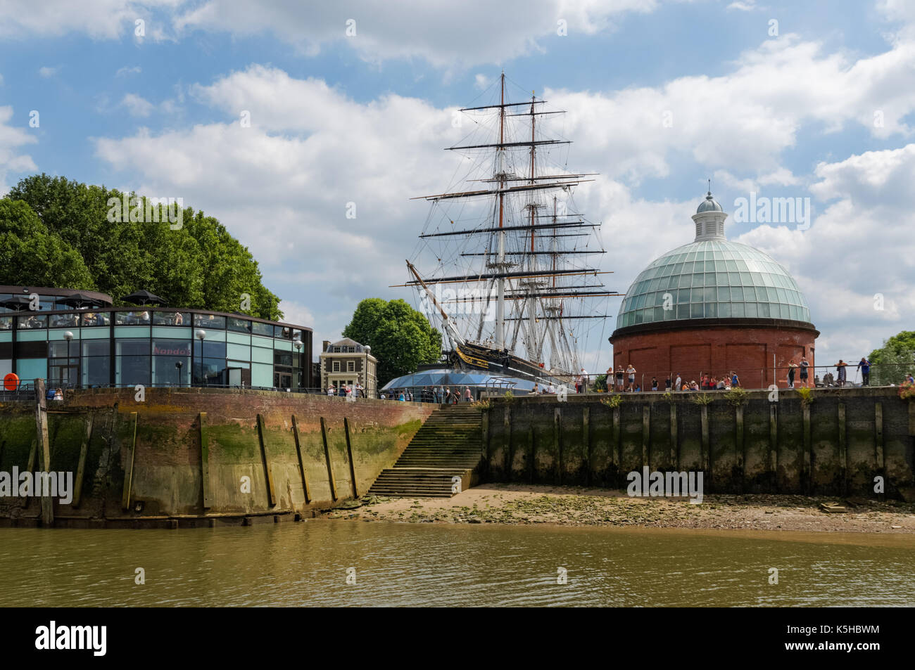 Greenwich Pier with Cutty Sark clipper ship and Greenwich Foot Tunnel entrance, London England ...