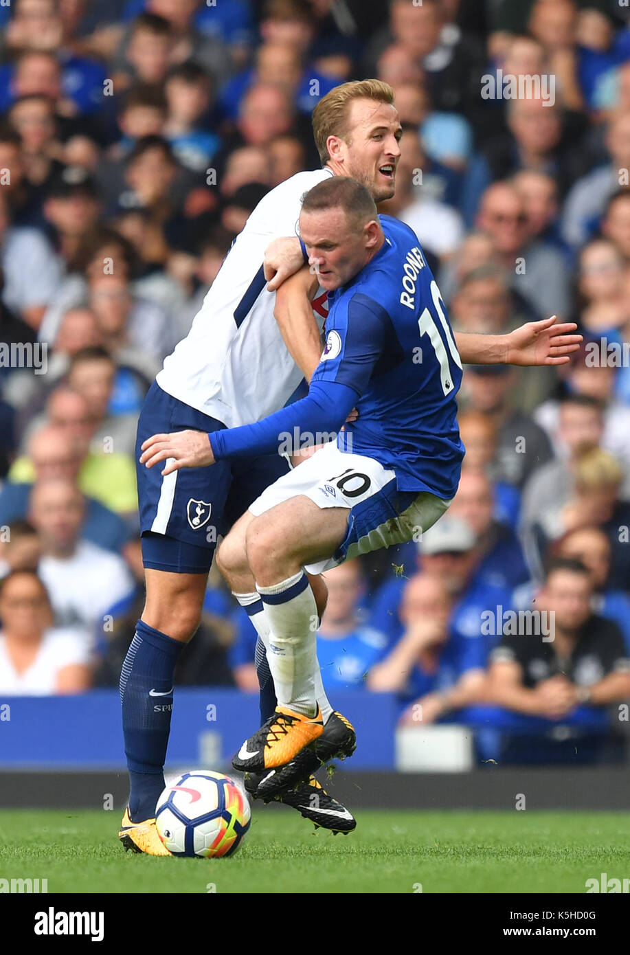 Tottenham Hotspur's Harry Kane (left) fouls Everton's Wayne Rooney ...