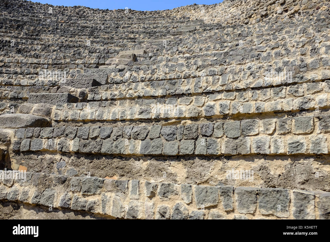 Ancient steps and seating are seen in this photography from Pompei on ...
