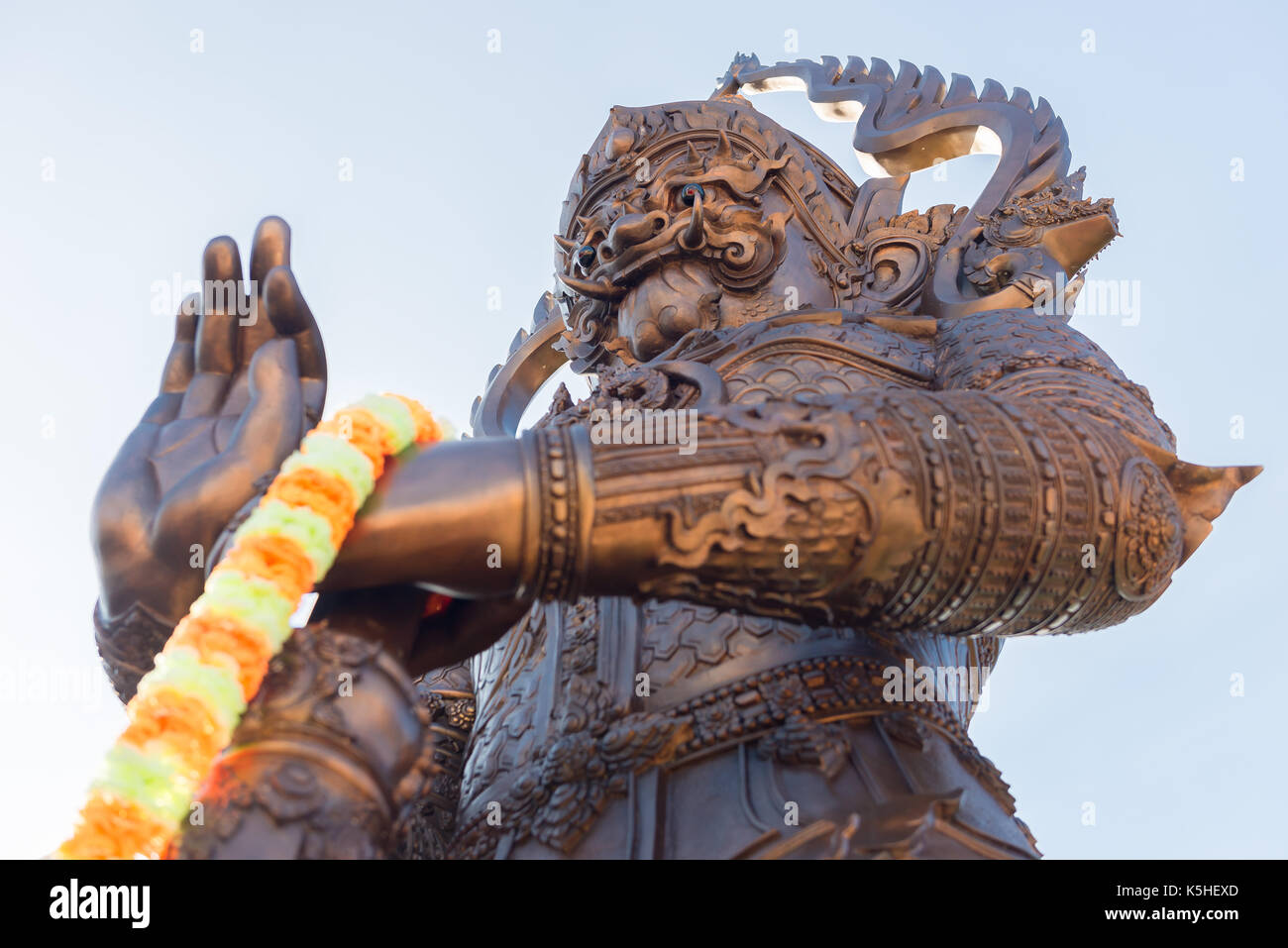 Standing giant with club and "stop" hand gesture. Isolated on black ...