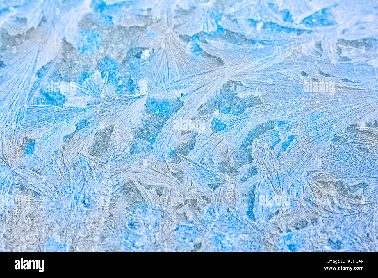 Blue background with spots and ice Stock Photo - Alamy