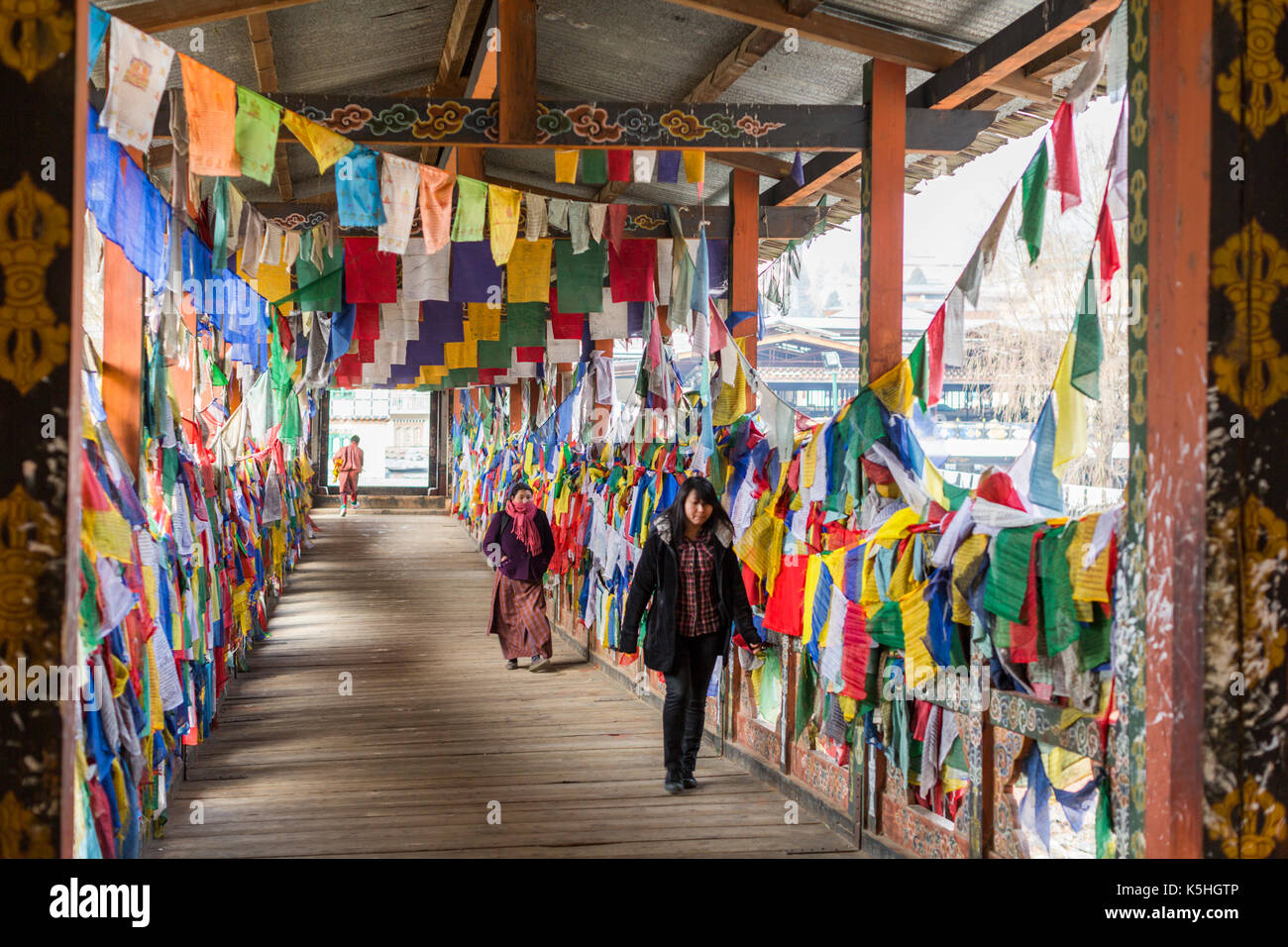 Covered bridge with prayer flags in Thimphu, Western Bhutan Stock Photo ...