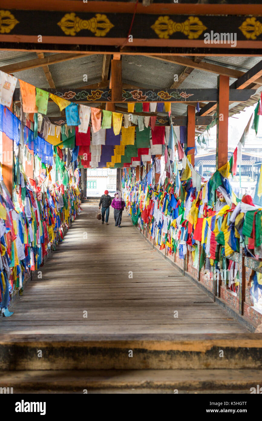 Covered bridge with prayer flags in Thimphu, Western Bhutan Stock Photo ...