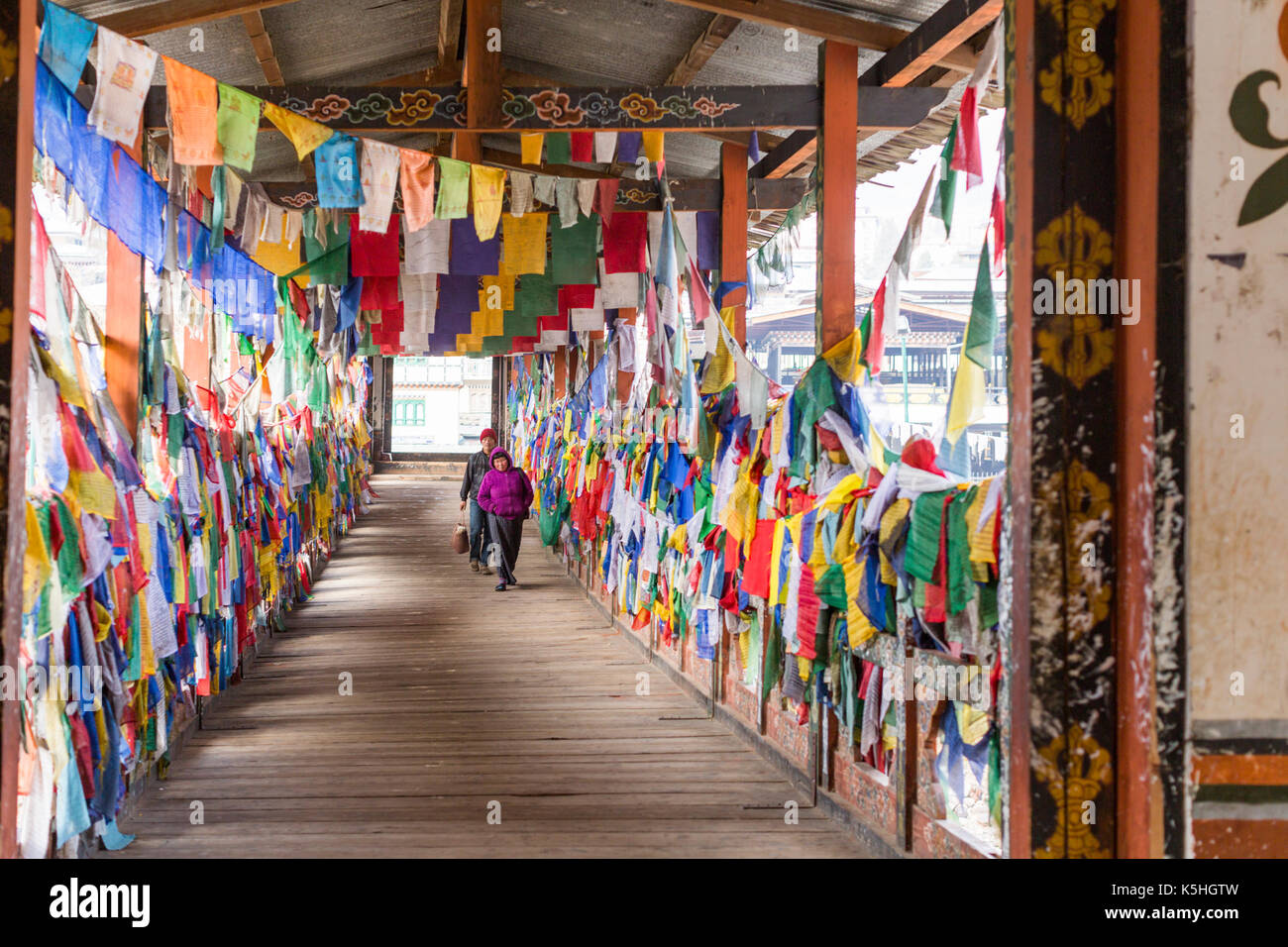 Covered bridge with prayer flags in Thimphu, Western Bhutan Stock Photo ...