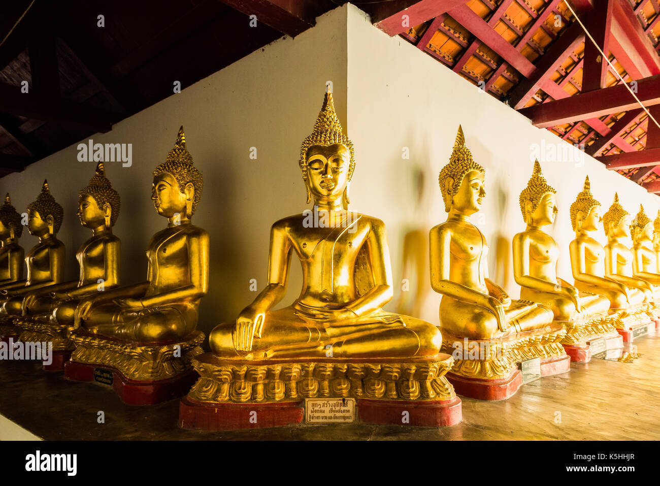 2 sides of light and shadow wtih buddha statues Stock Photo - Alamy