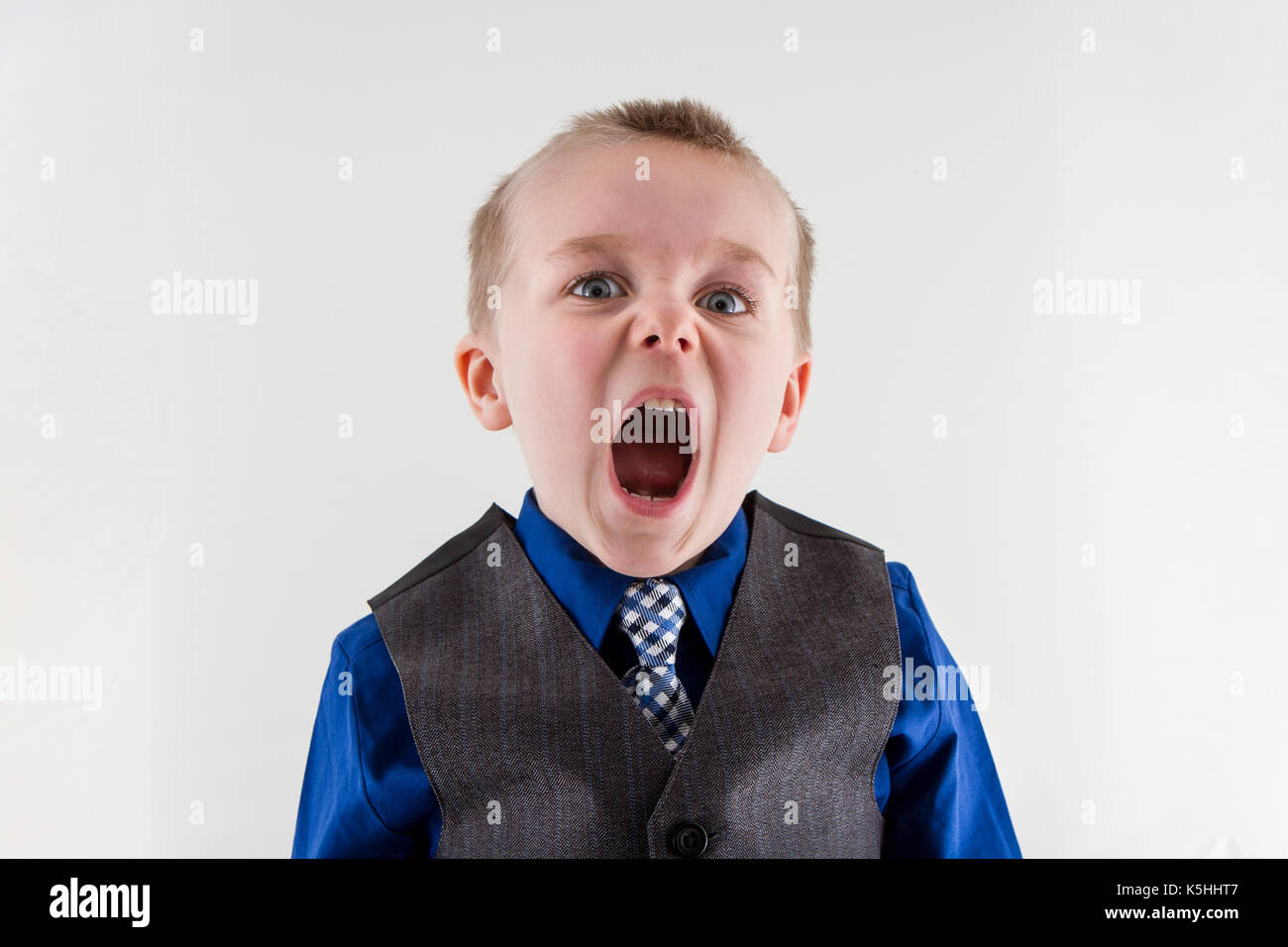 Young boy screaming at the top of his lungs Stock Photo - Alamy