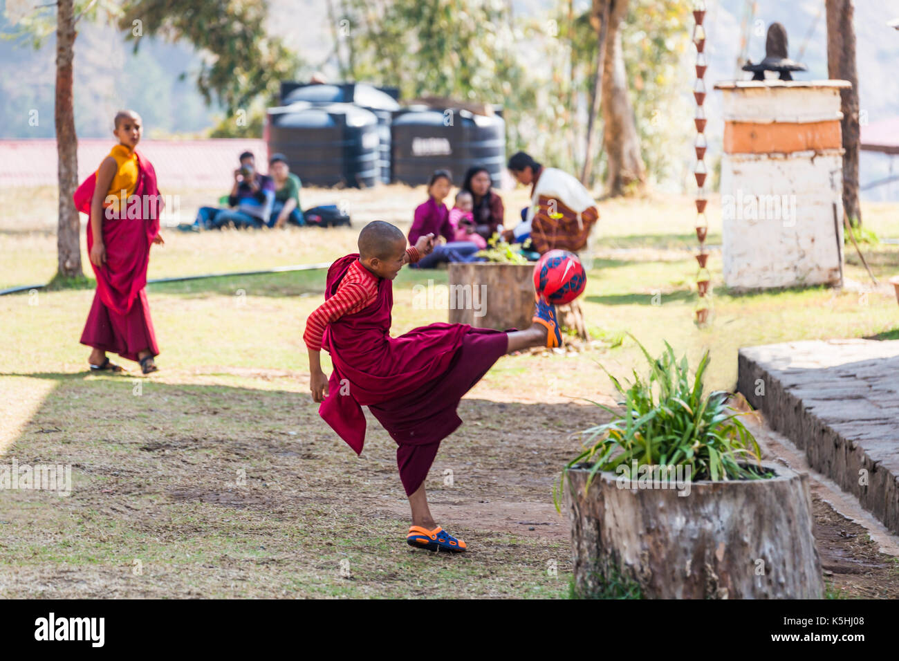 Young monks playing soccer at Chimi Lakhang (temple) near Lobesa ...